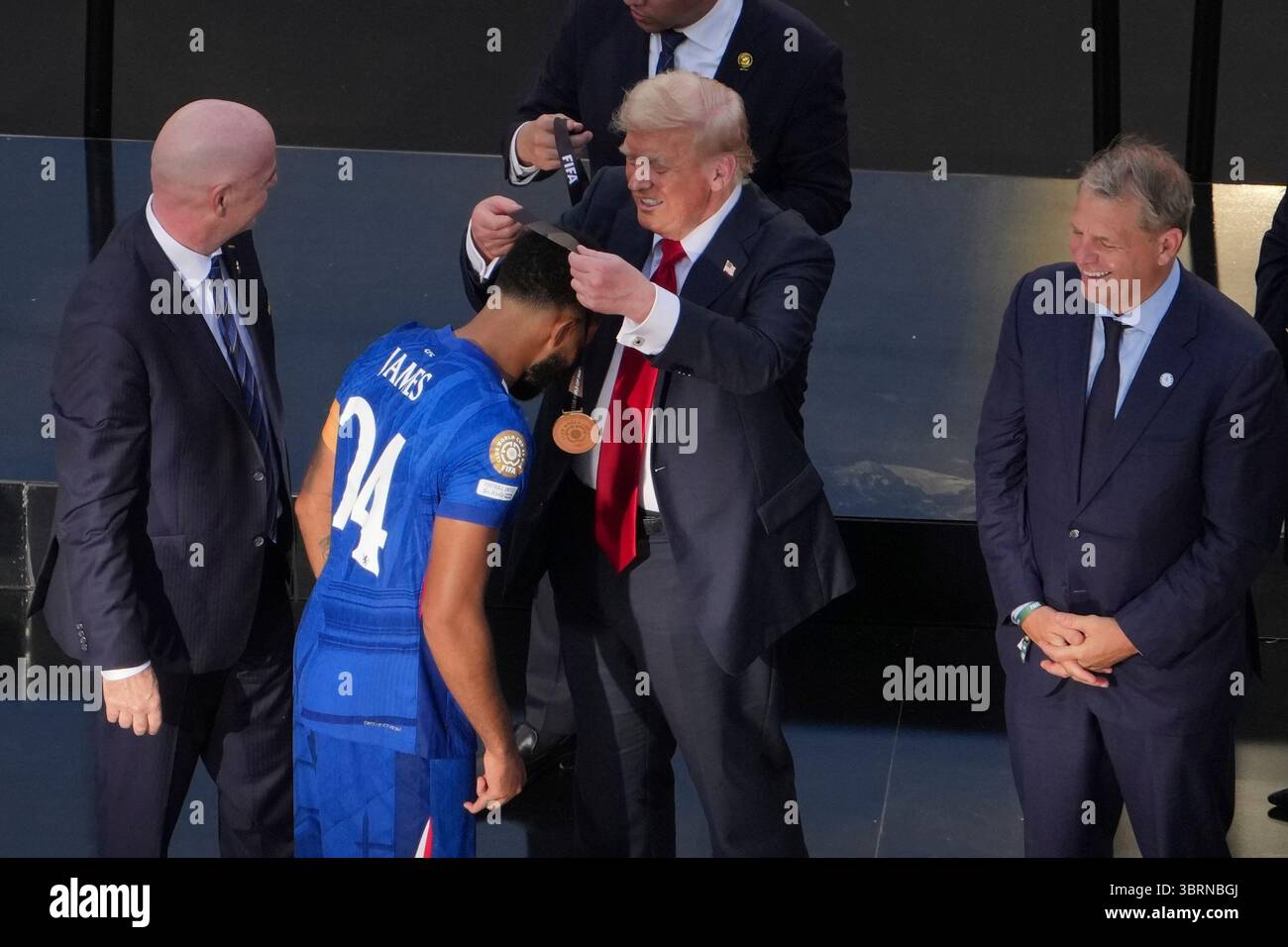 Chelsea's Reece James (24) receives his championship medal from President Donald Trump after the ...