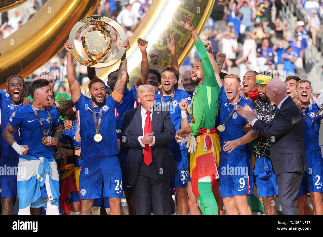 Chelsea's Reece James (24) lifts the trophy as President Donald Trump ...