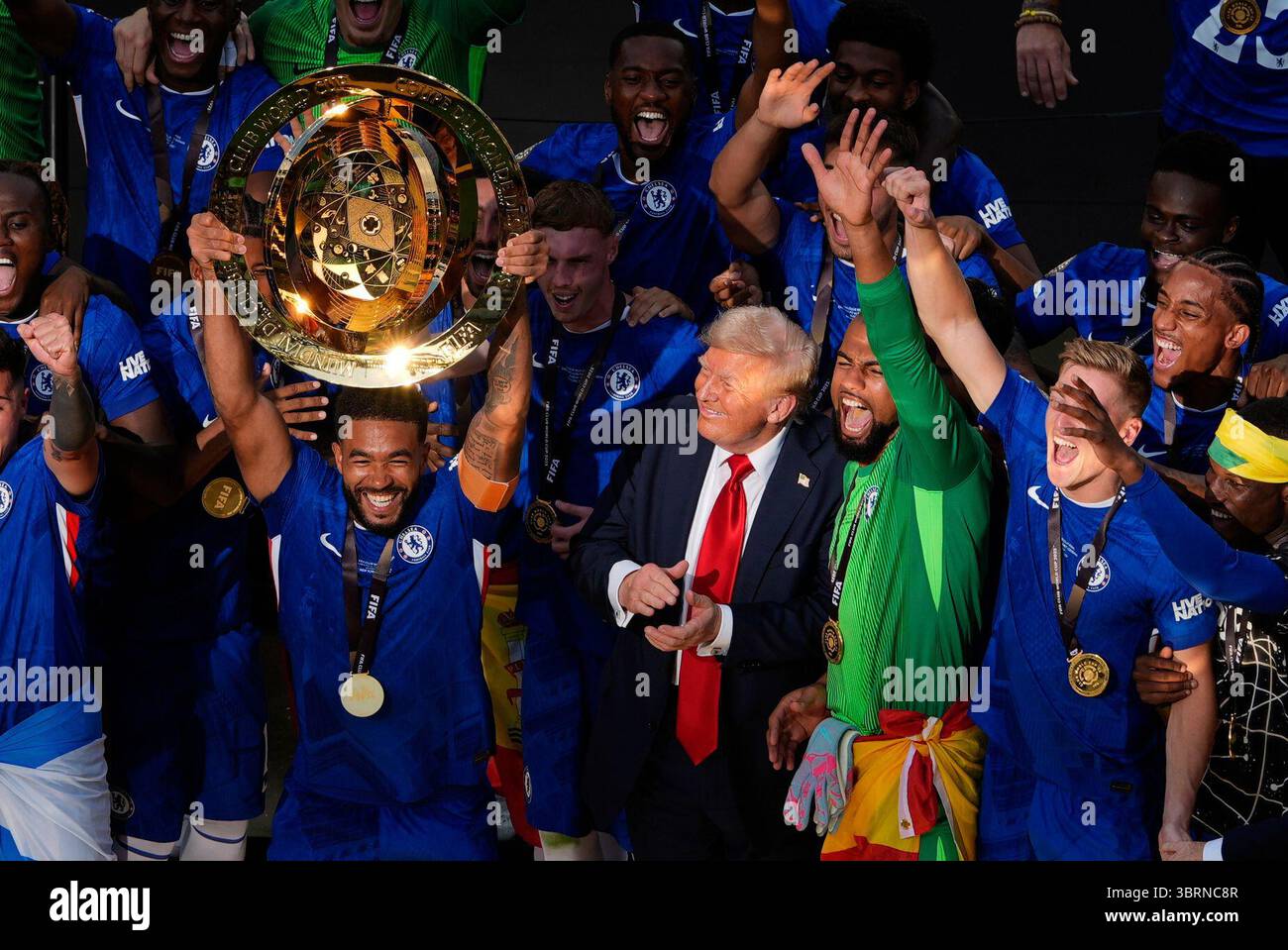 Chelsea's Reece James lifts the trophy besides President Donald Trump ...