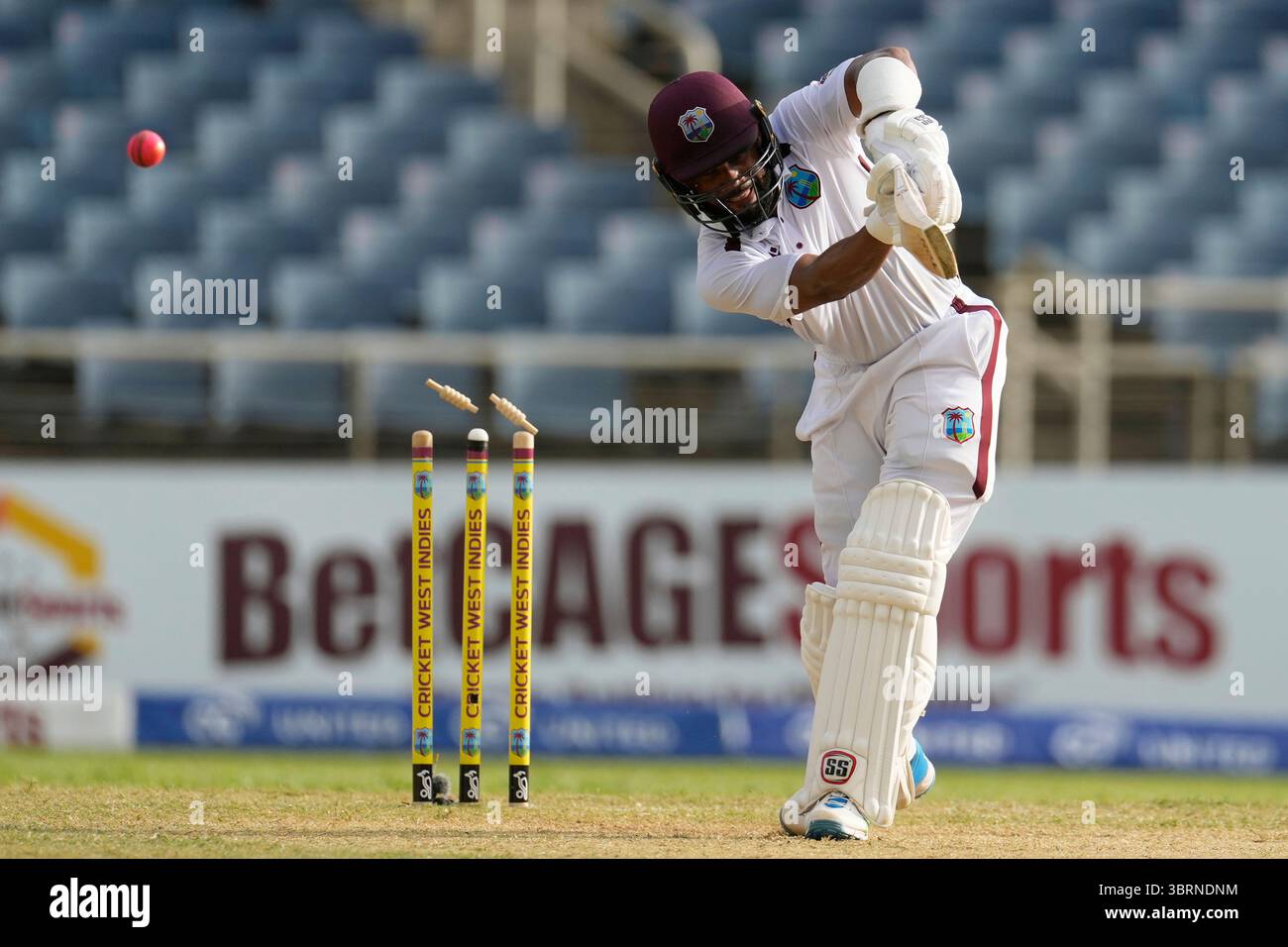 West Indies' Shai Hope is bowled by Australia's Scott Boland on day two ...