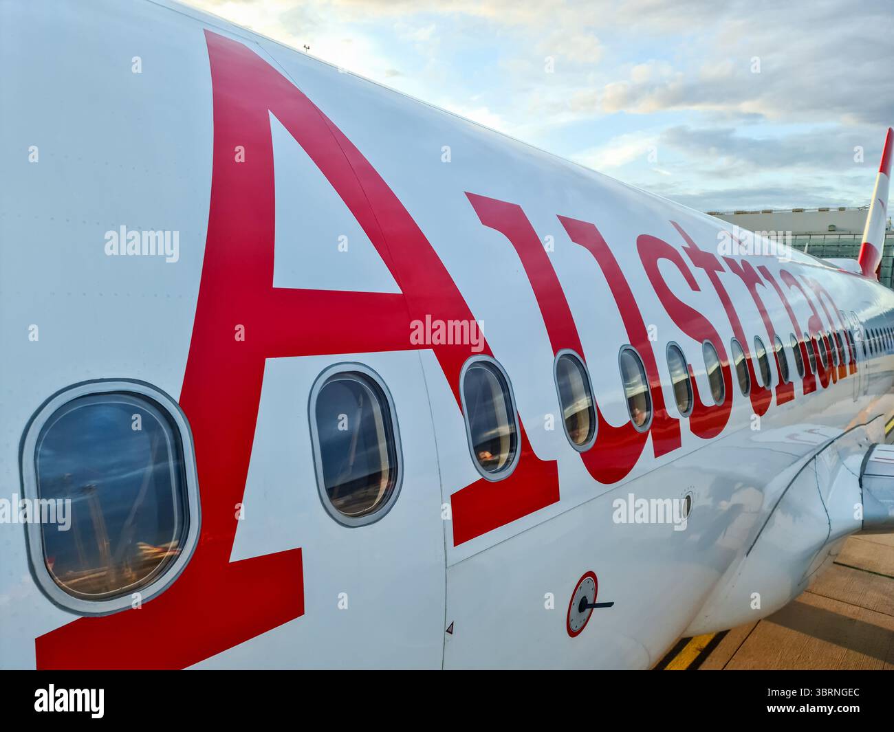Vienna, Austria - 12. July 2025: White airplane with red Austrian ...