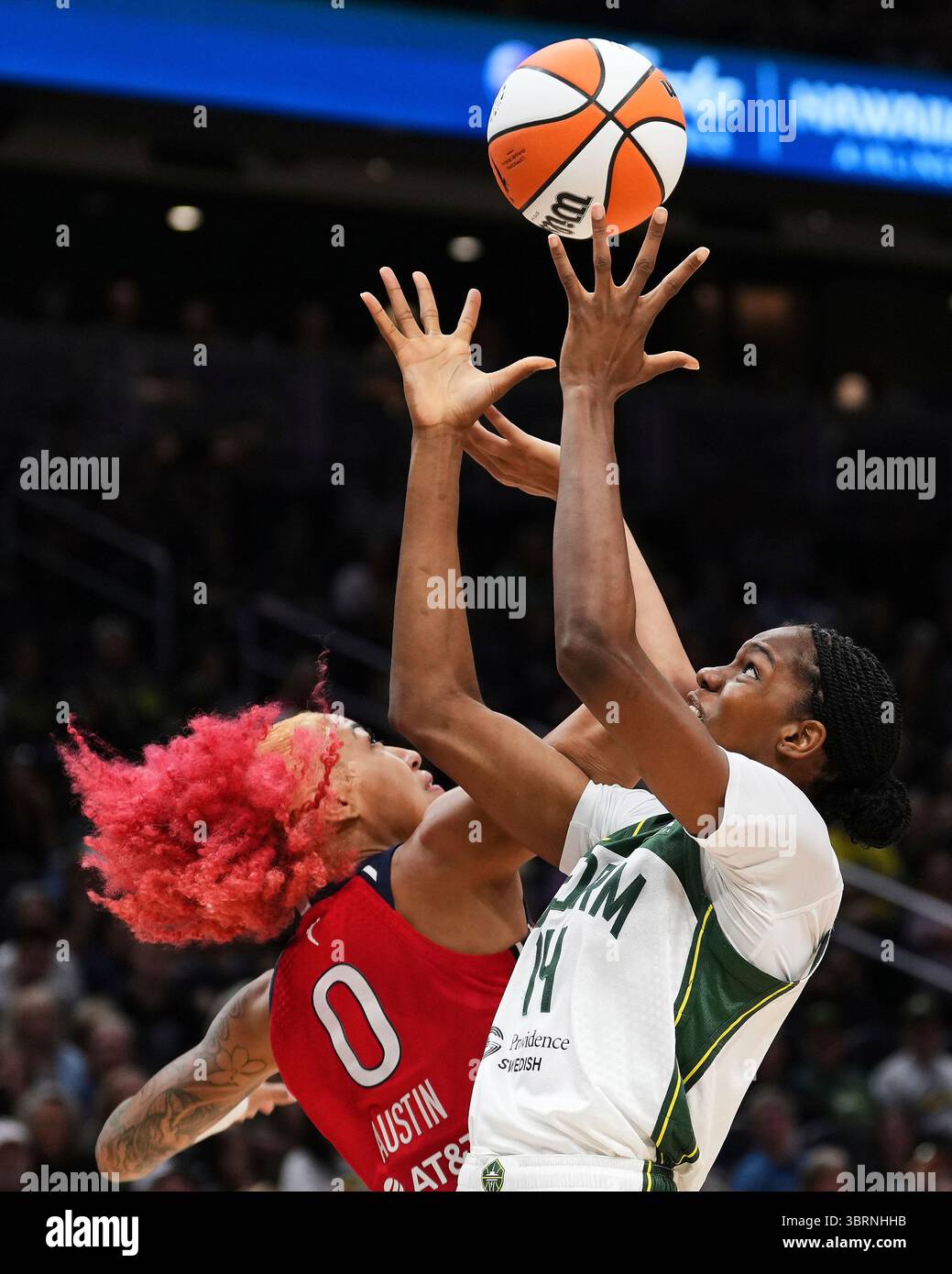 Seattle Storm center Dominique Malonga, right, reaches for the ball ...