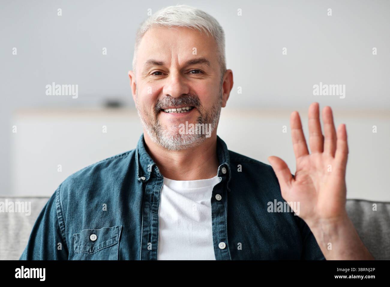 Happy senior bearded man waving hi-res stock photography and images - Alamy
