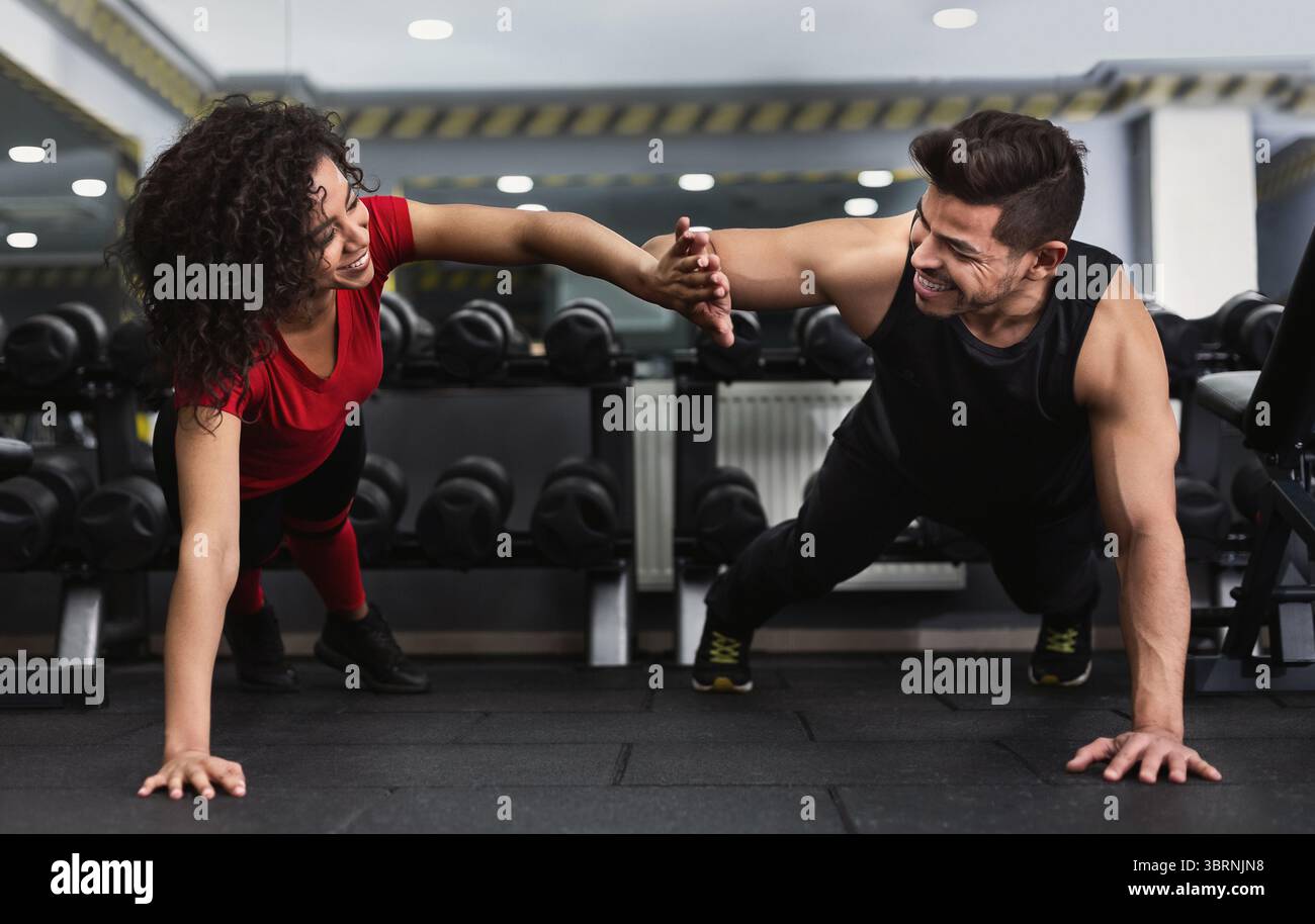 Happy diverse couple doing ups hi-res stock photography and images - Alamy