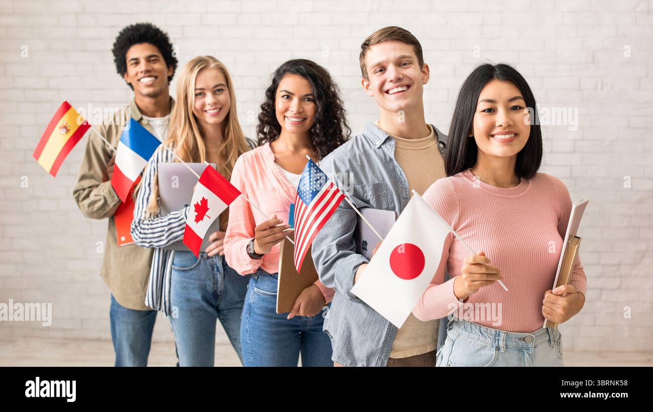 International multi-ethnic student exchange. Cheerful young people with ...