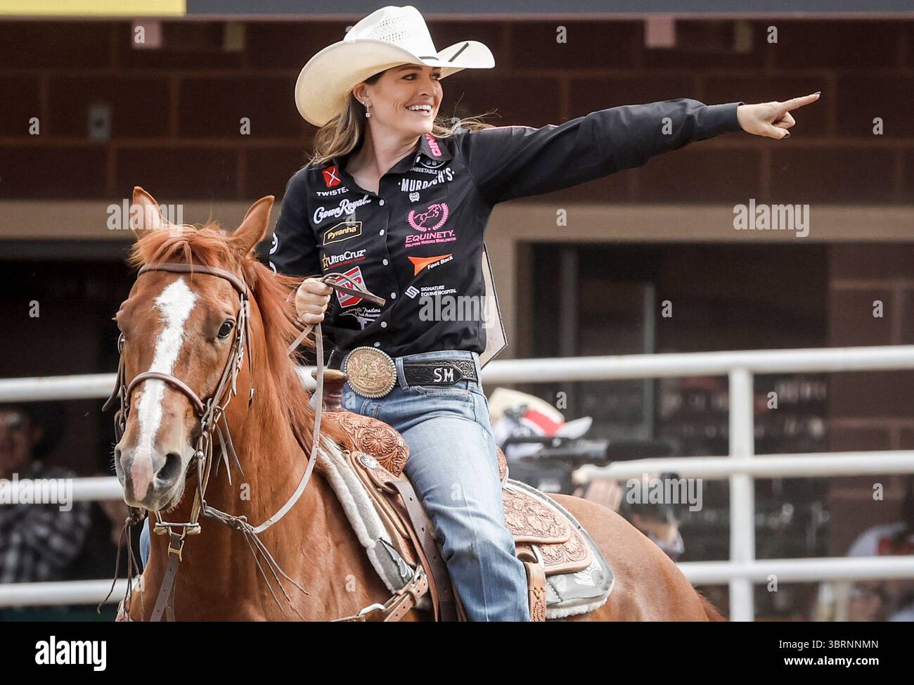 Shelby Boisjoli-Meged, of Langdon, Alberta, celebrates winning the ...