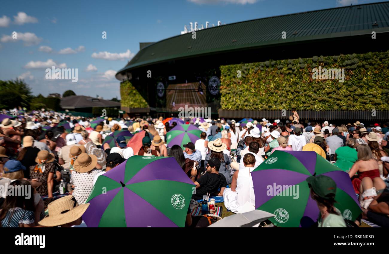 Wimbledon, UK. 13th July, 2025. A general view of crowds on Henman Hill ...