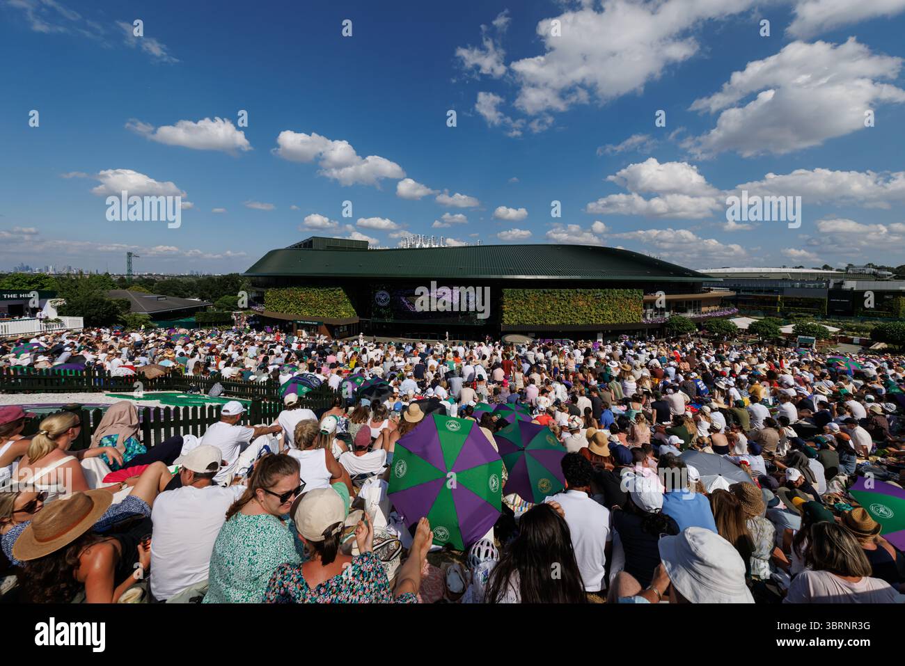 Wimbledon, UK. 13th July, 2025. A general view of crowds on Henman Hill ...