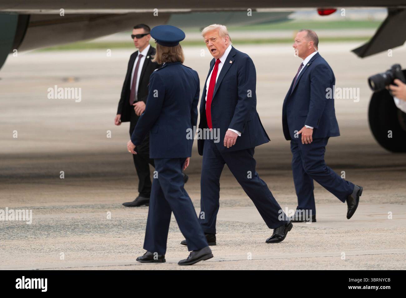 President Donald Trump talks to Air Force Col. Angela F. Ochoa ...