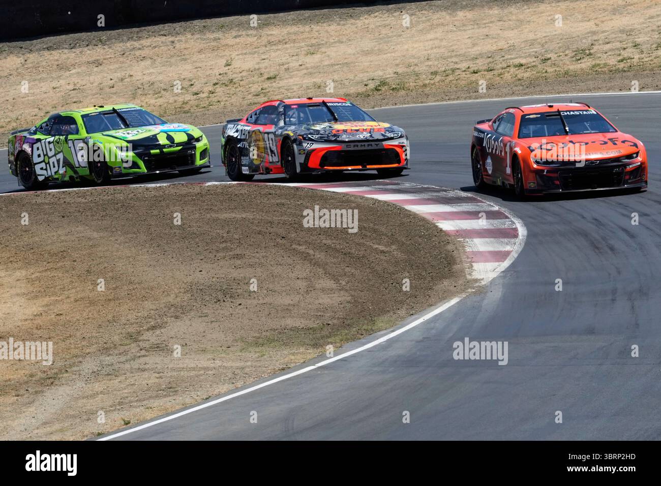 Ross Chastain, right, drives while followed by Chase Briscoe (19) and ...