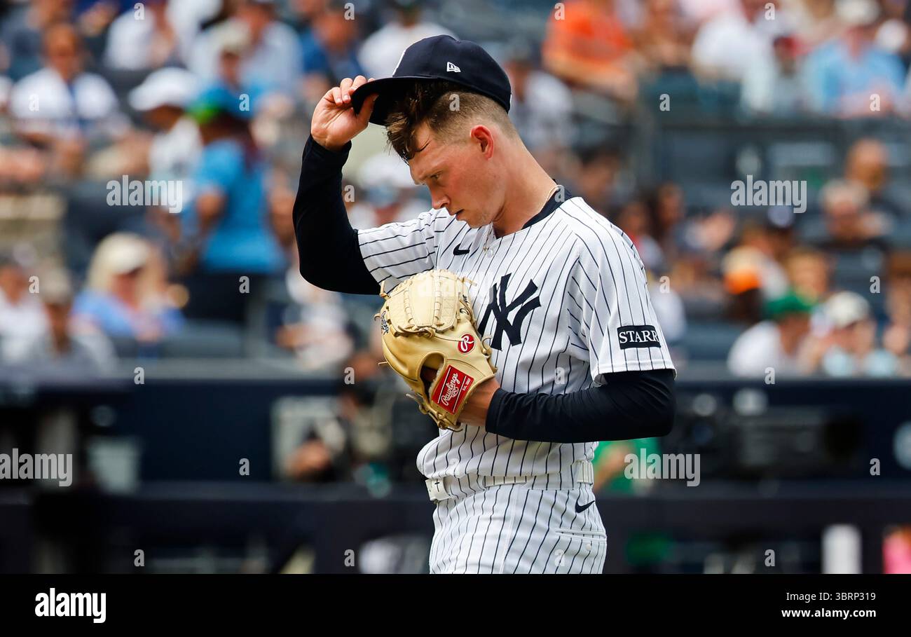 New York Yankees pitcher Will Warren (98) goes to the dugout during the ...