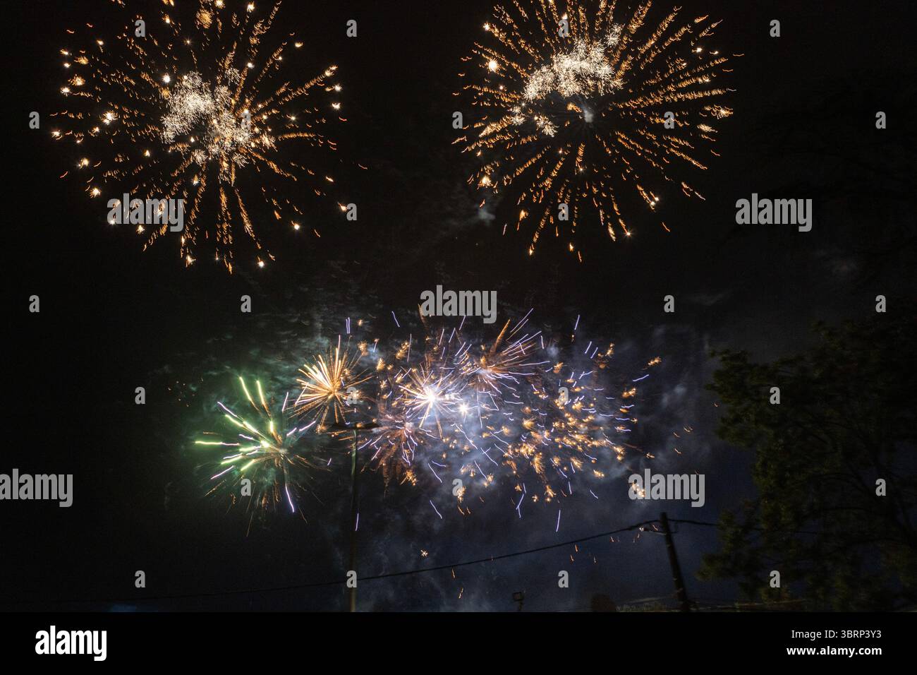 Brilliant white, red, and gold fireworks is seen explode in full ...