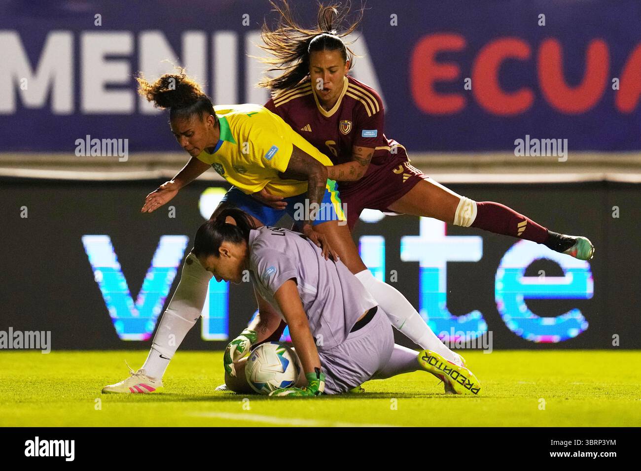 Brazil goalkeeper Lorena, bottom, Brazil's Tarciane, center, and ...
