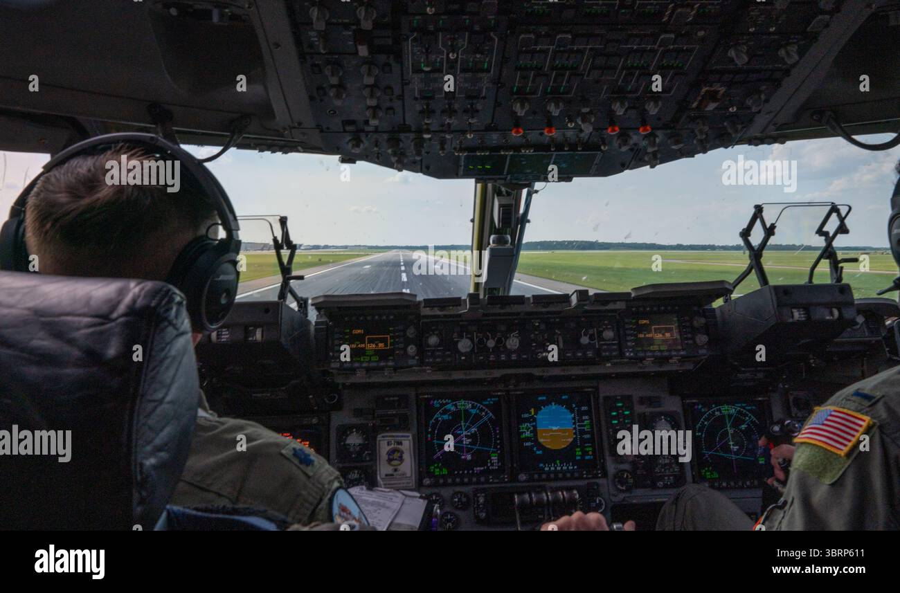 Lt. Col. Seth Rann, 326th Airlift Squadron instructor pilot, left ...