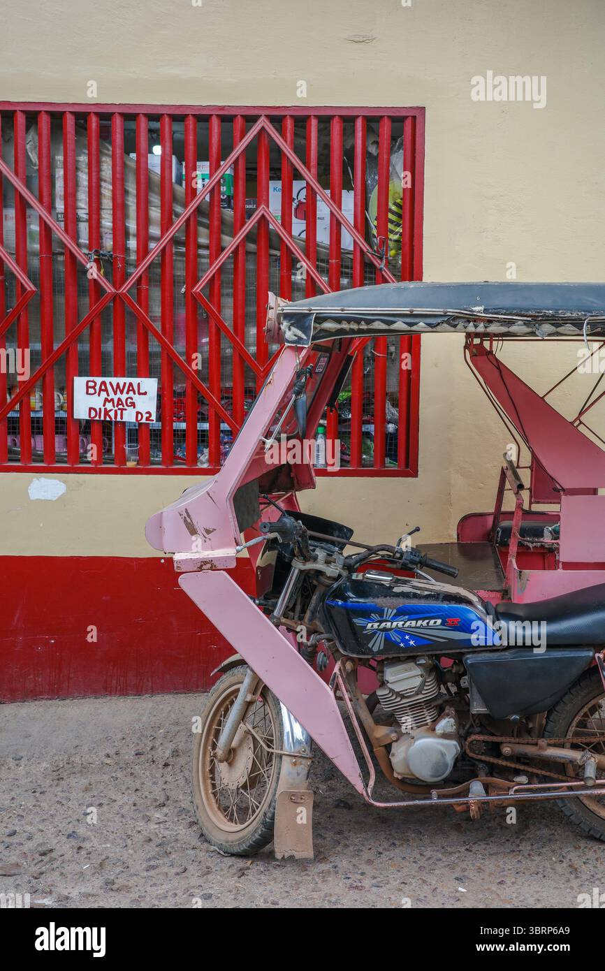 A traditional and colorful design of Filipino tricycle, a public ...