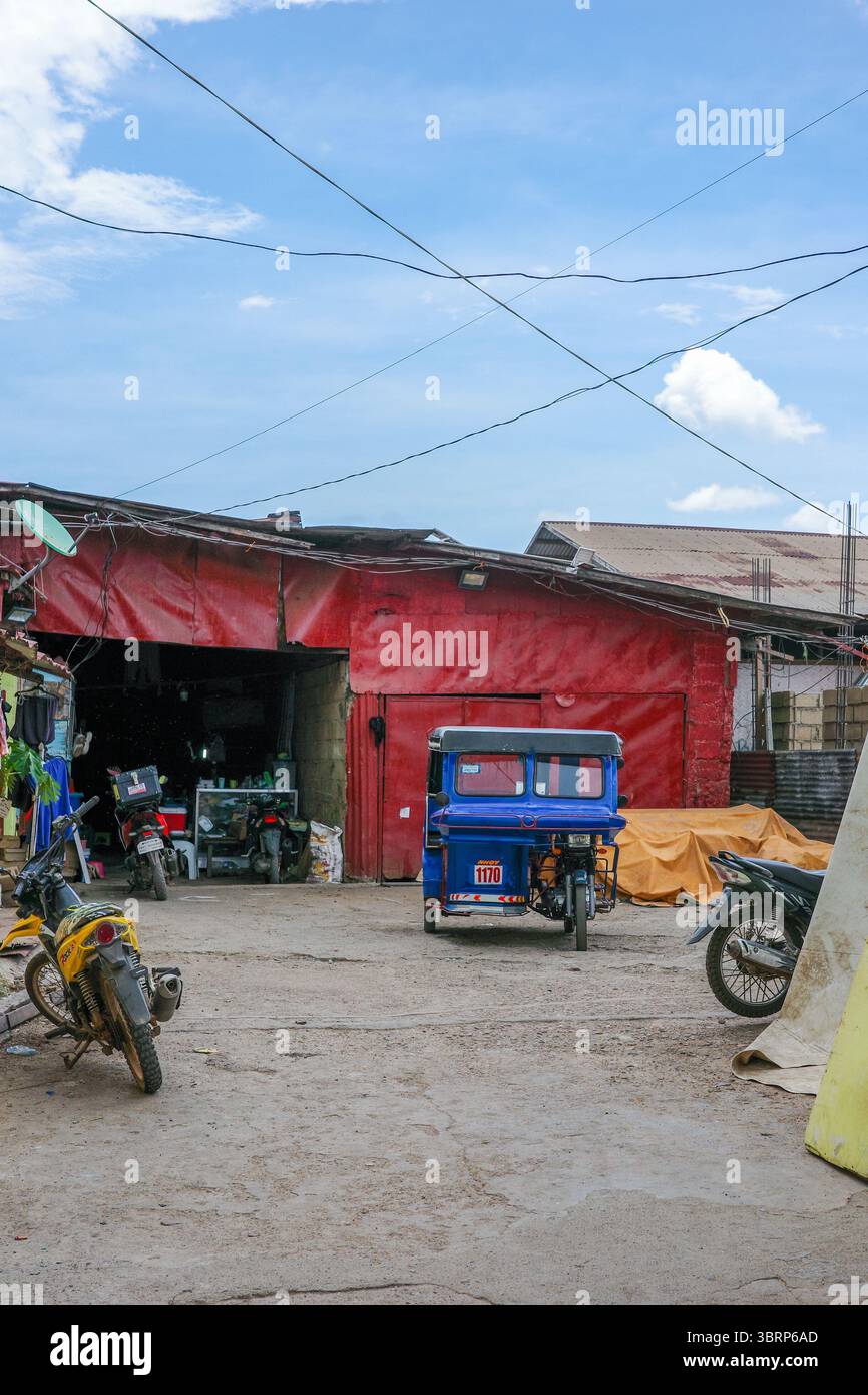 A traditional and colorful designed Filipino tricycle, a public ...