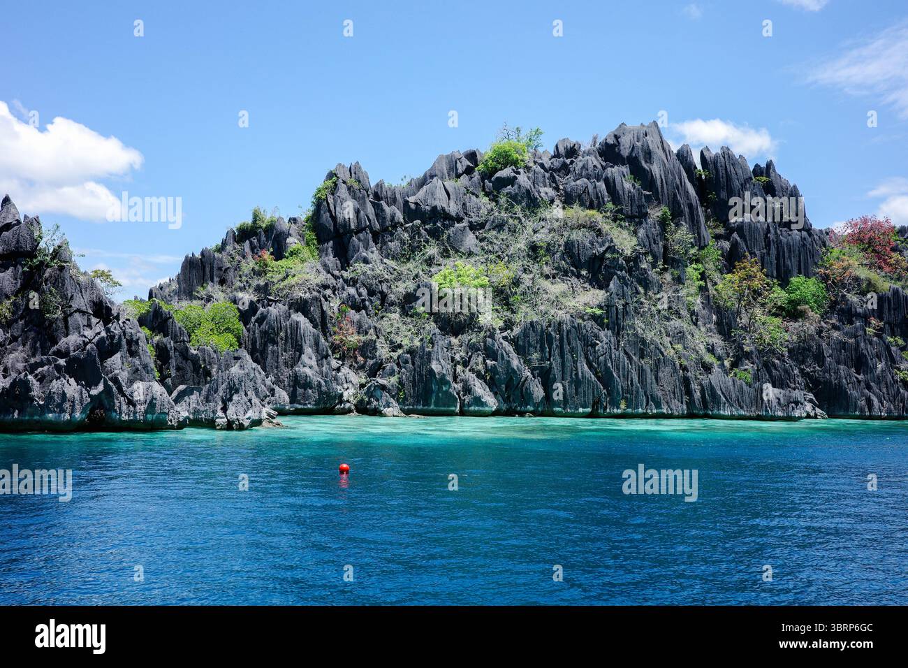 A beautiful view of limestone cliffs, clear blue sky and deep blue ...