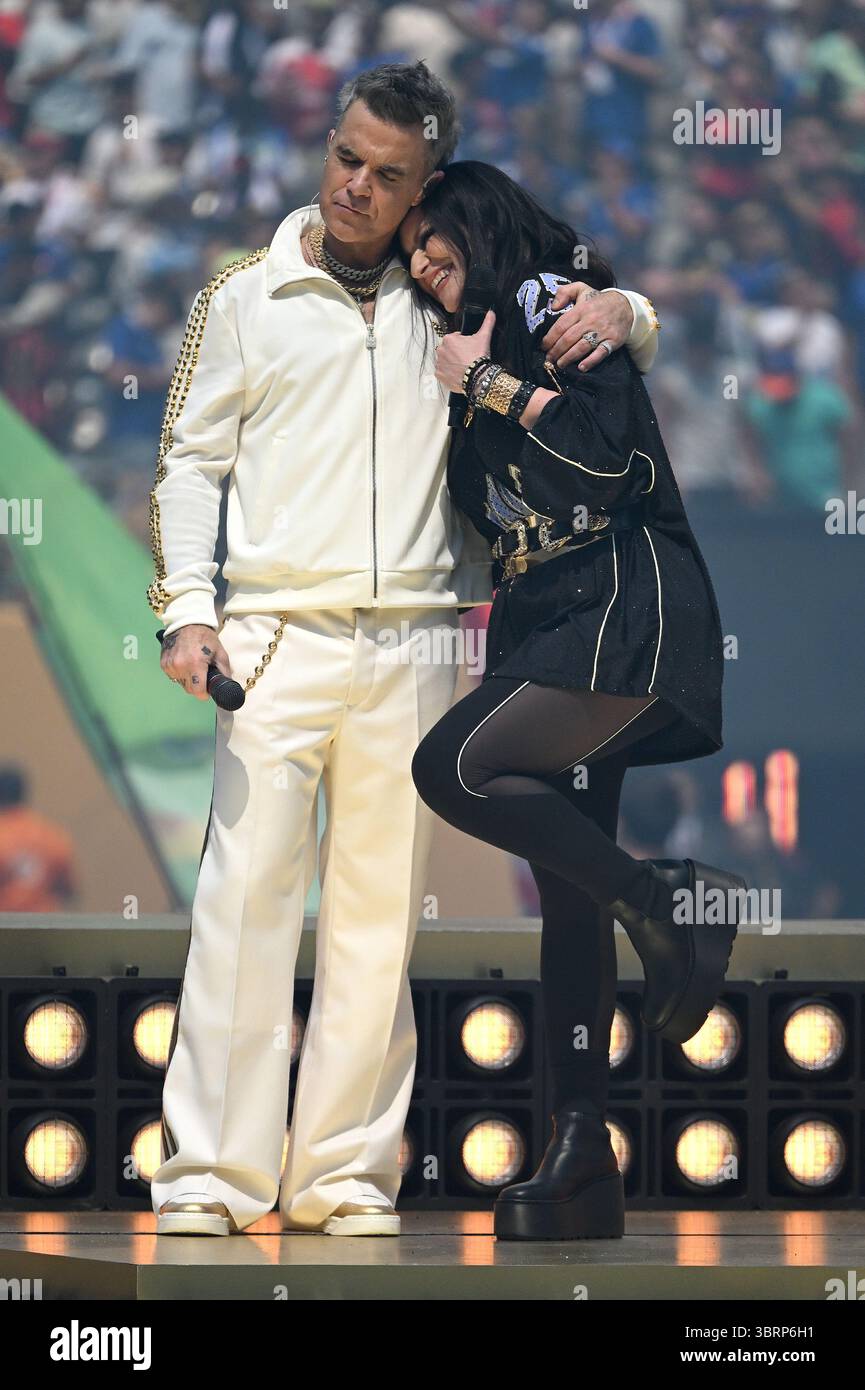 East Rutherford, USA. 13th July, 2025. (L-R) Singers Robbie Williams ...