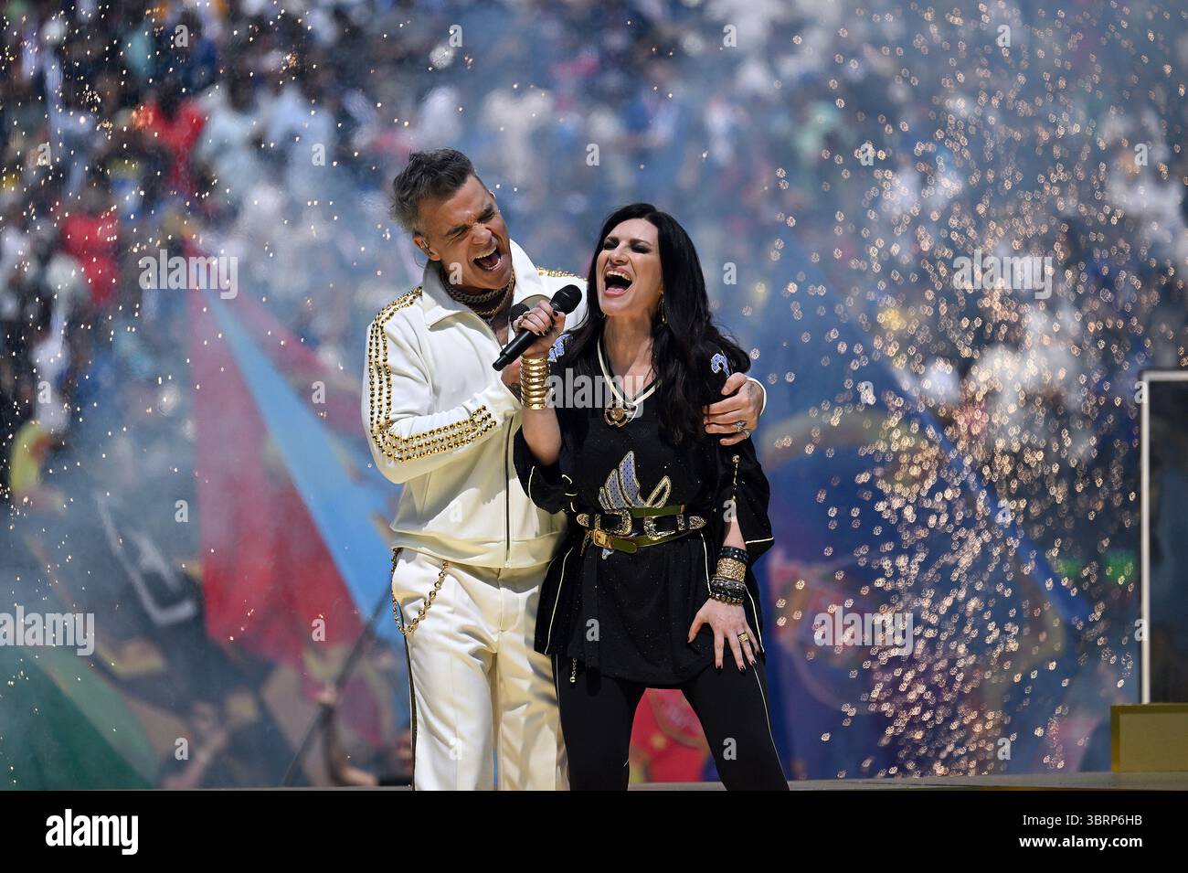East Rutherford, USA. 13th July, 2025. (L-R) Singers Robbie Williams ...