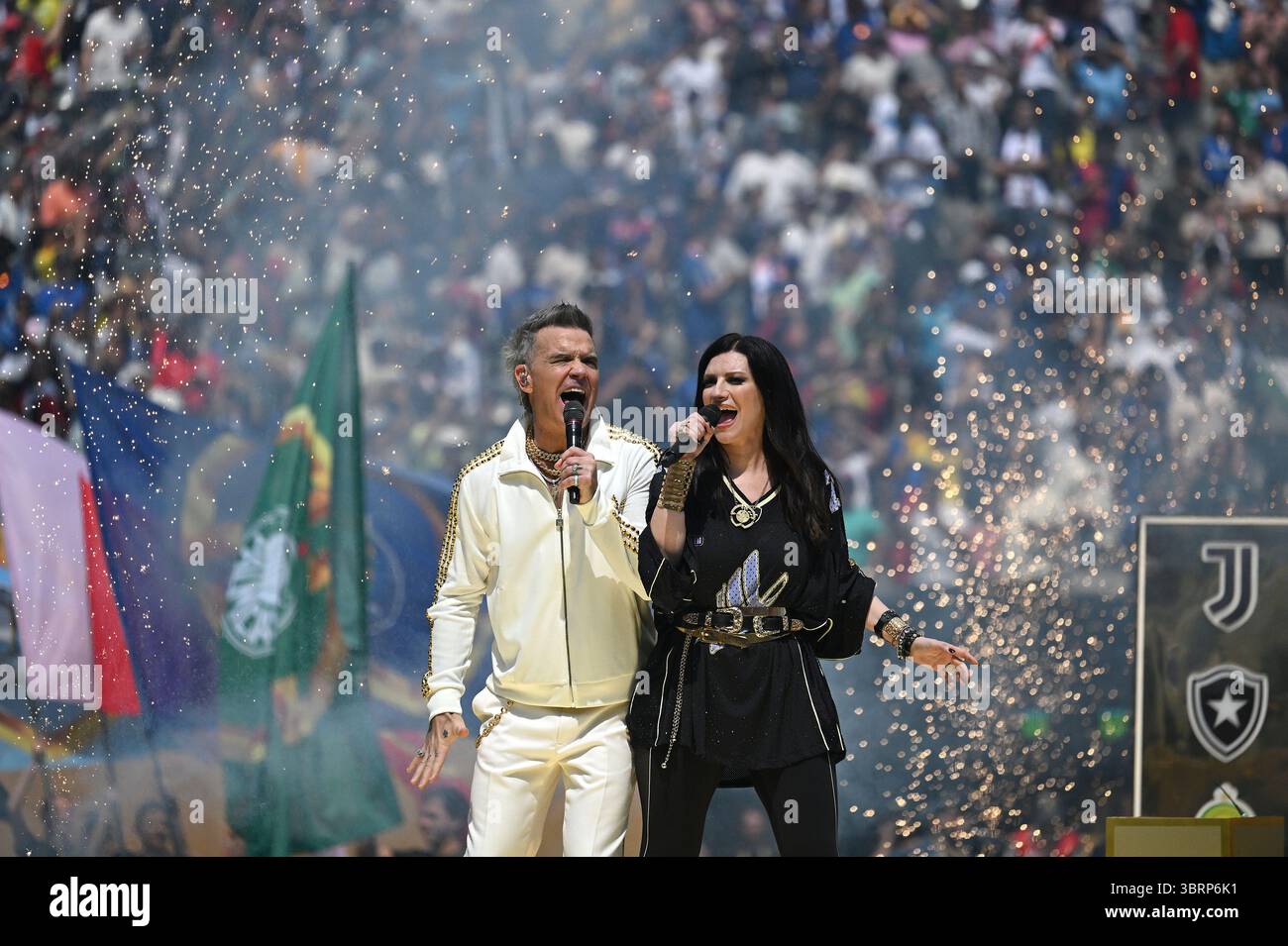East Rutherford, USA. 13th July, 2025. (L-R) Singers Robbie Williams ...