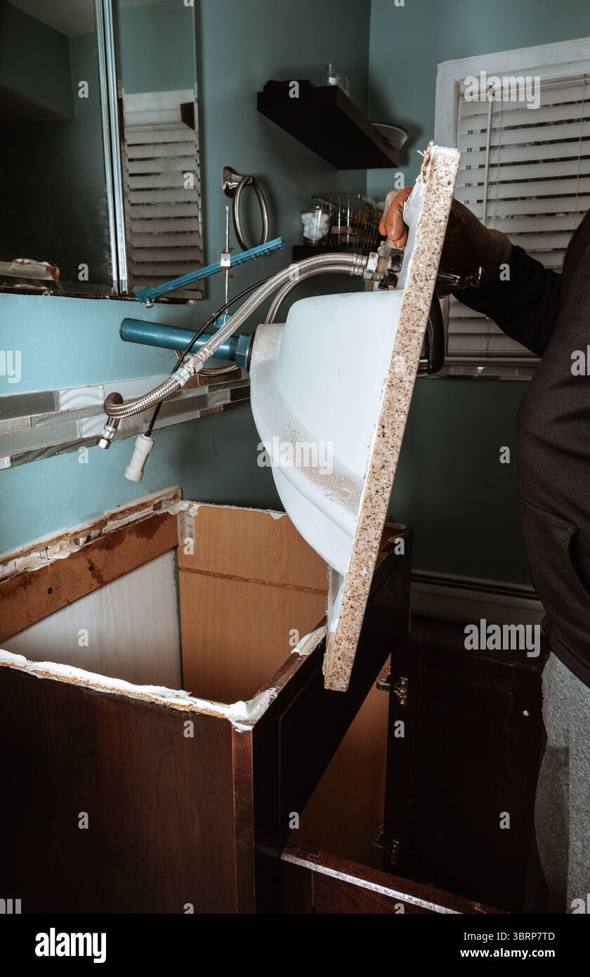 Man replacing old sink hi-res stock photography and images - Alamy
