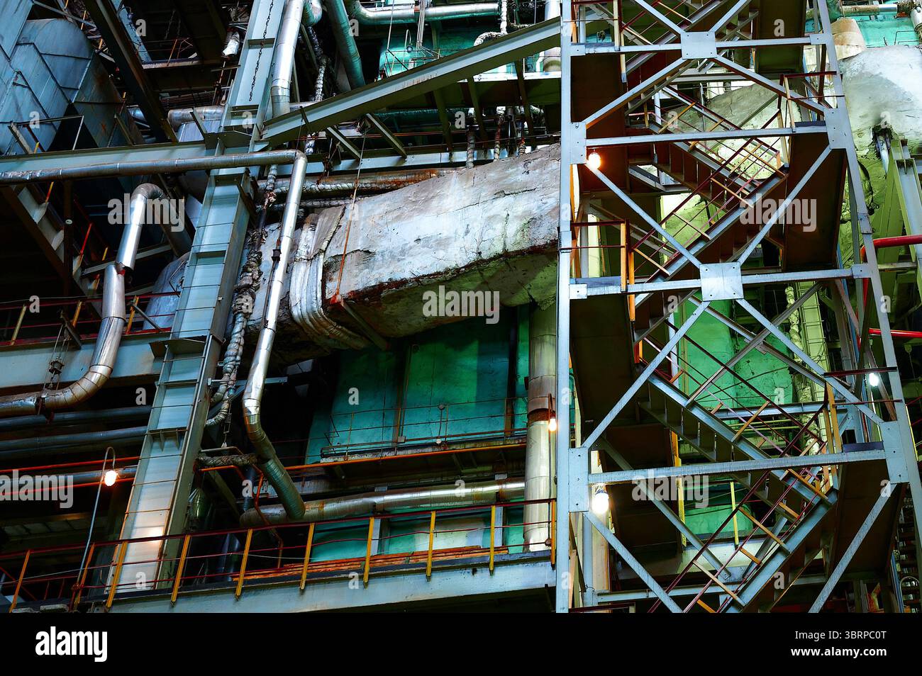 Industrial plant interior showcasing complex piping and structural ...