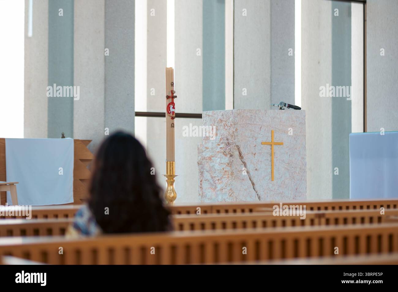 Asian woman praying inside a catholic church with cross and Altar Stock ...