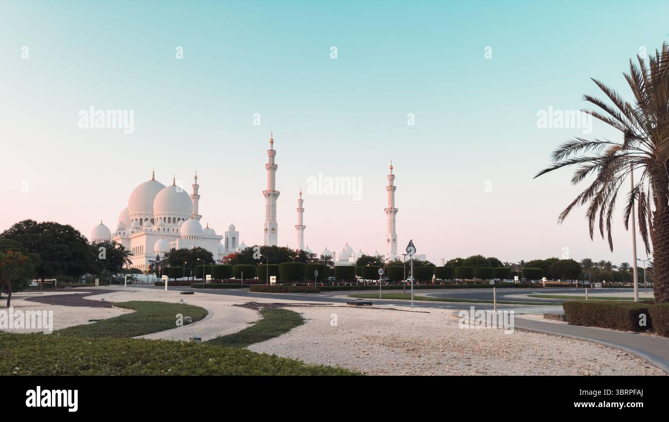 Cinematic view of Sheikh Zayed Mosque architecture at sunset, shining ...