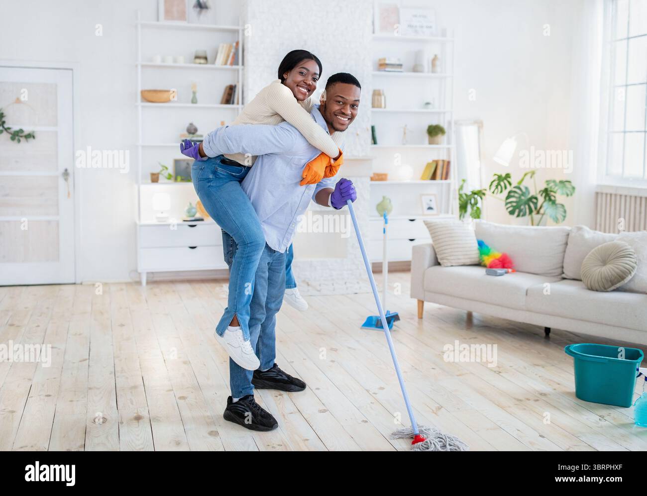 Positive black guy giving piggyback ride to his wife while washing ...