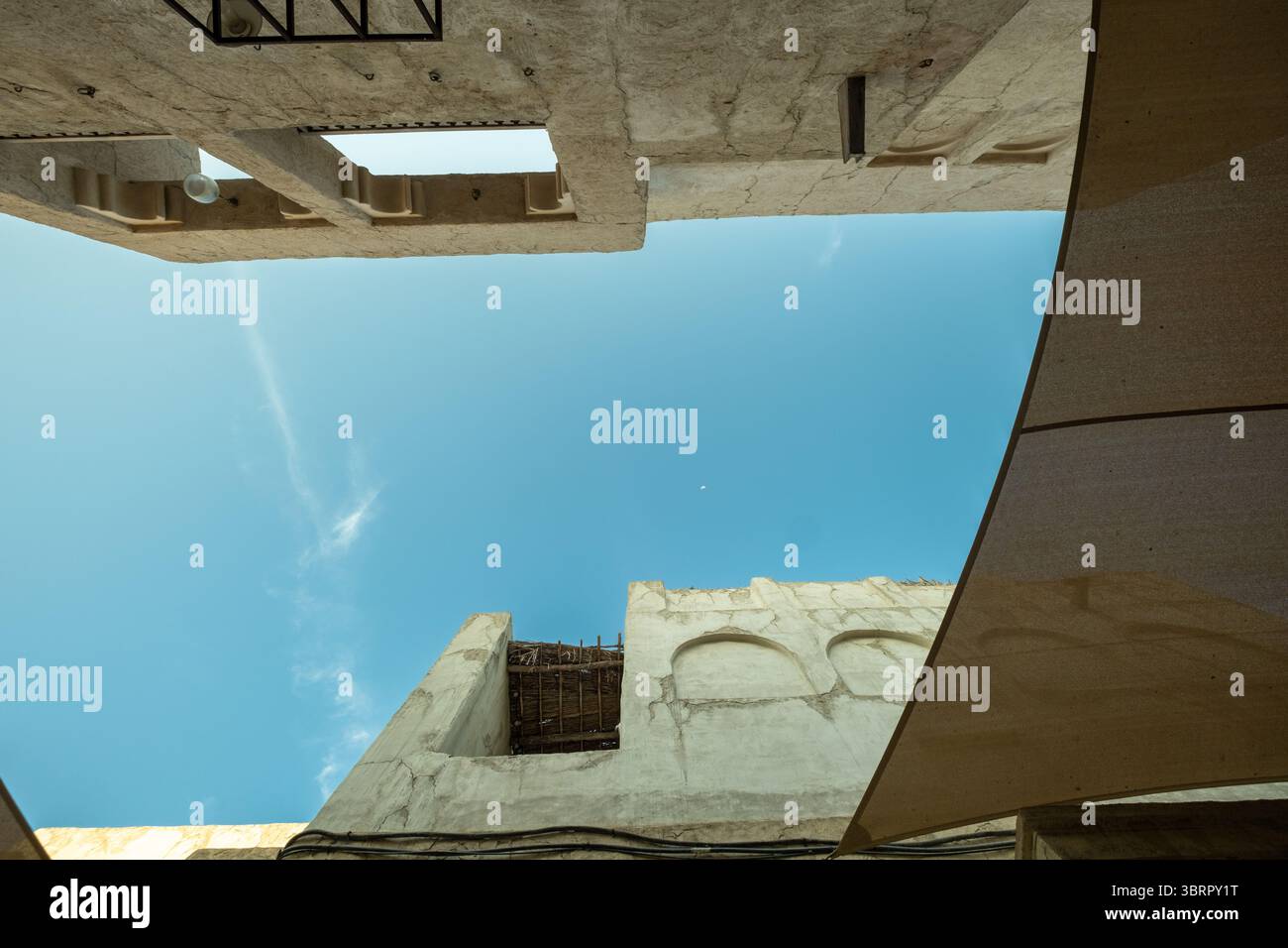 top view of Al seef heritage buildings with blue sky, shot from below ...
