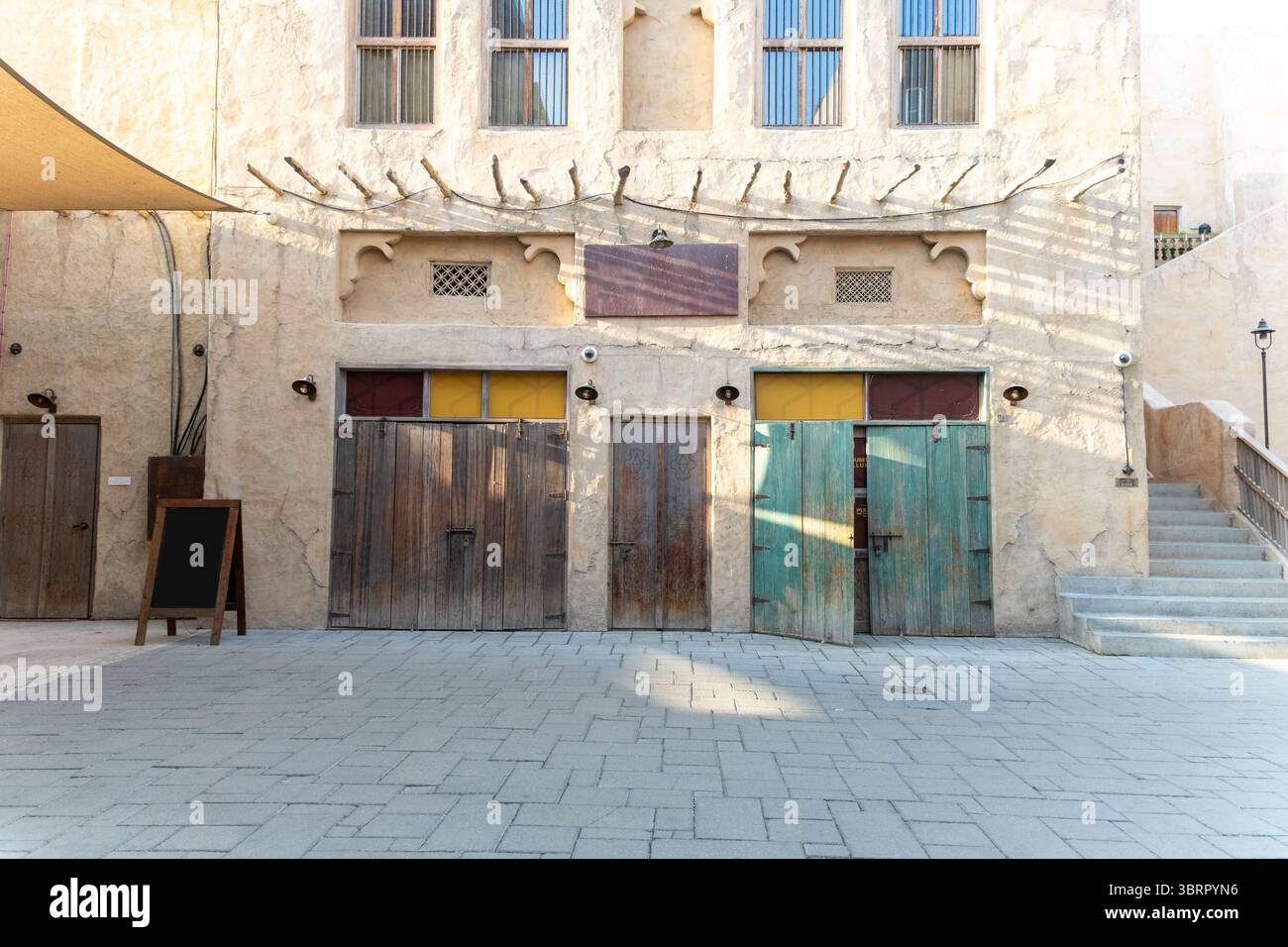 al seef historical neighborhood architecture Dubai with colorful wooden ...