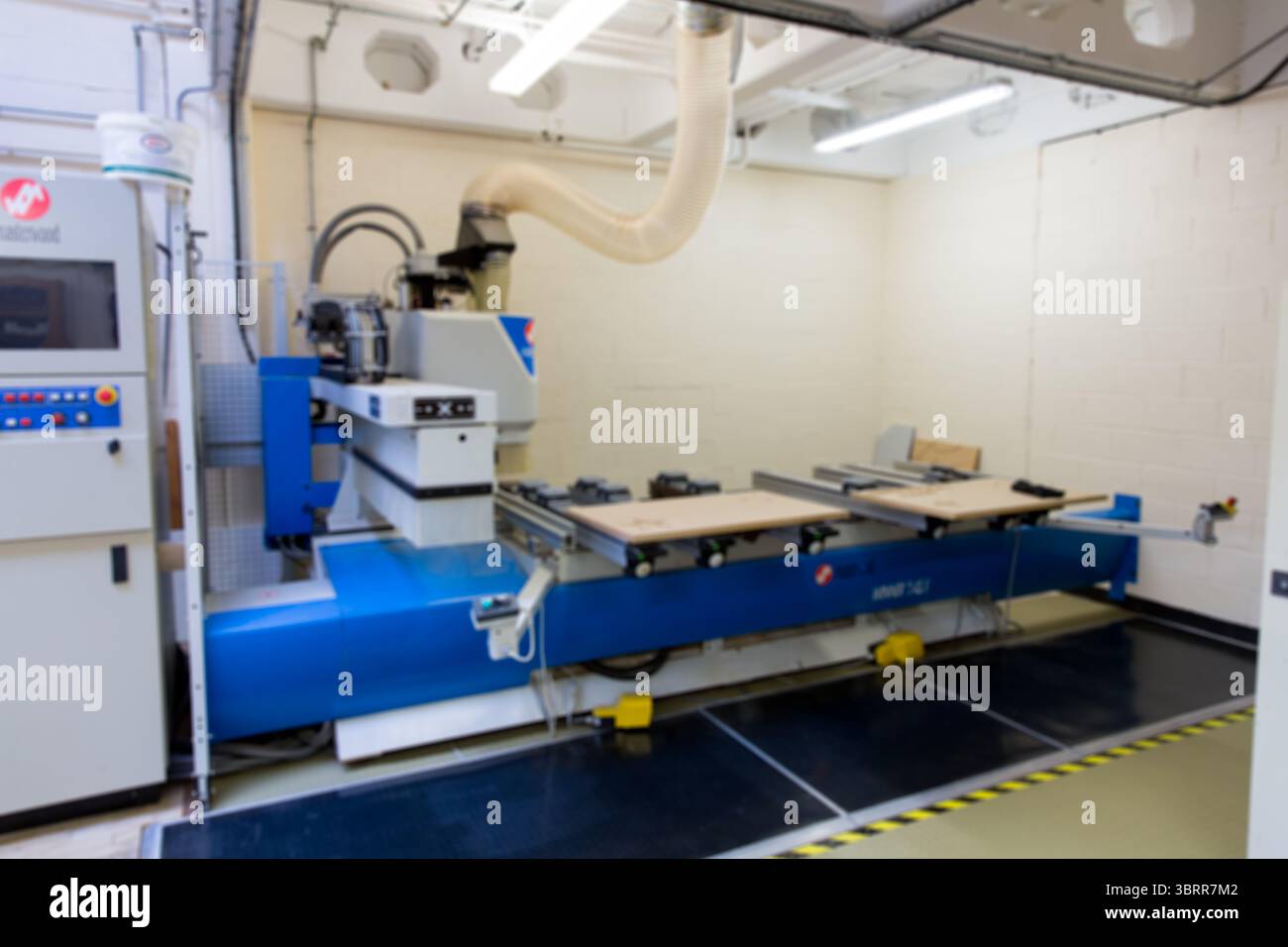 3D render showing blue CNC milling machine is working in workshop with ...