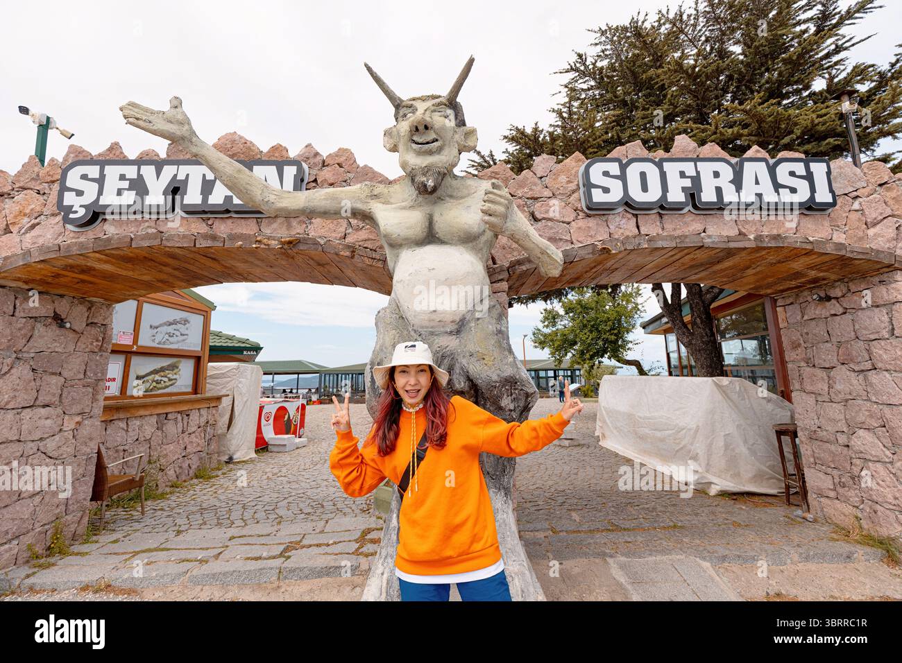 02 May 2025, Ayvalik, Turkiye: Tourist girl making a scary face at ...
