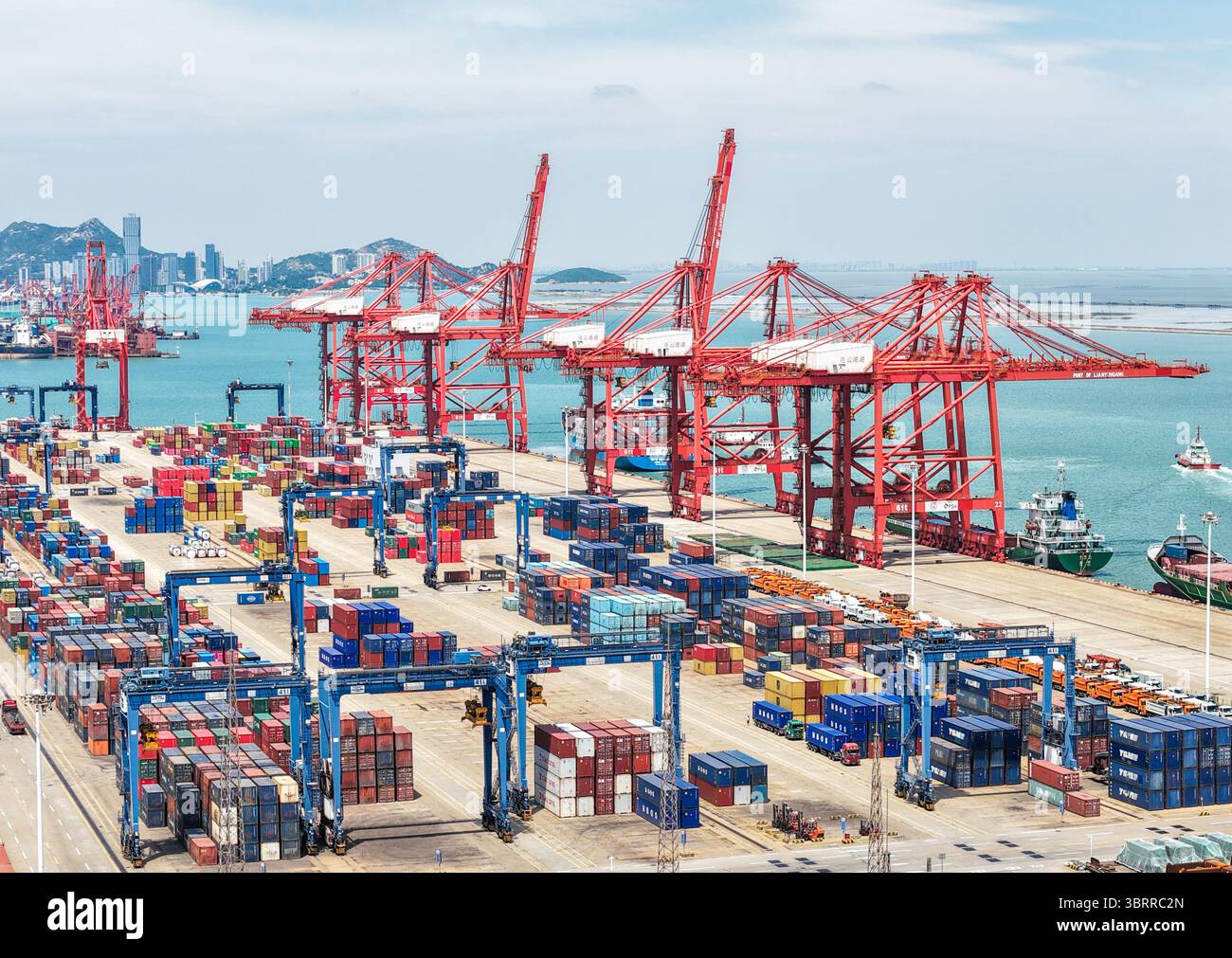 Cargo ships are loading and unloading containers at the foreign trade ...