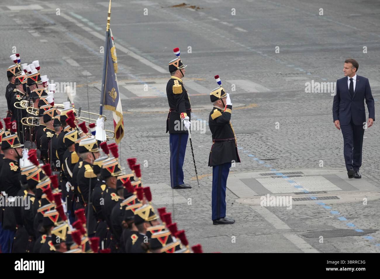 French President Emmanuel Macron, right, reviews Republican Guards ...