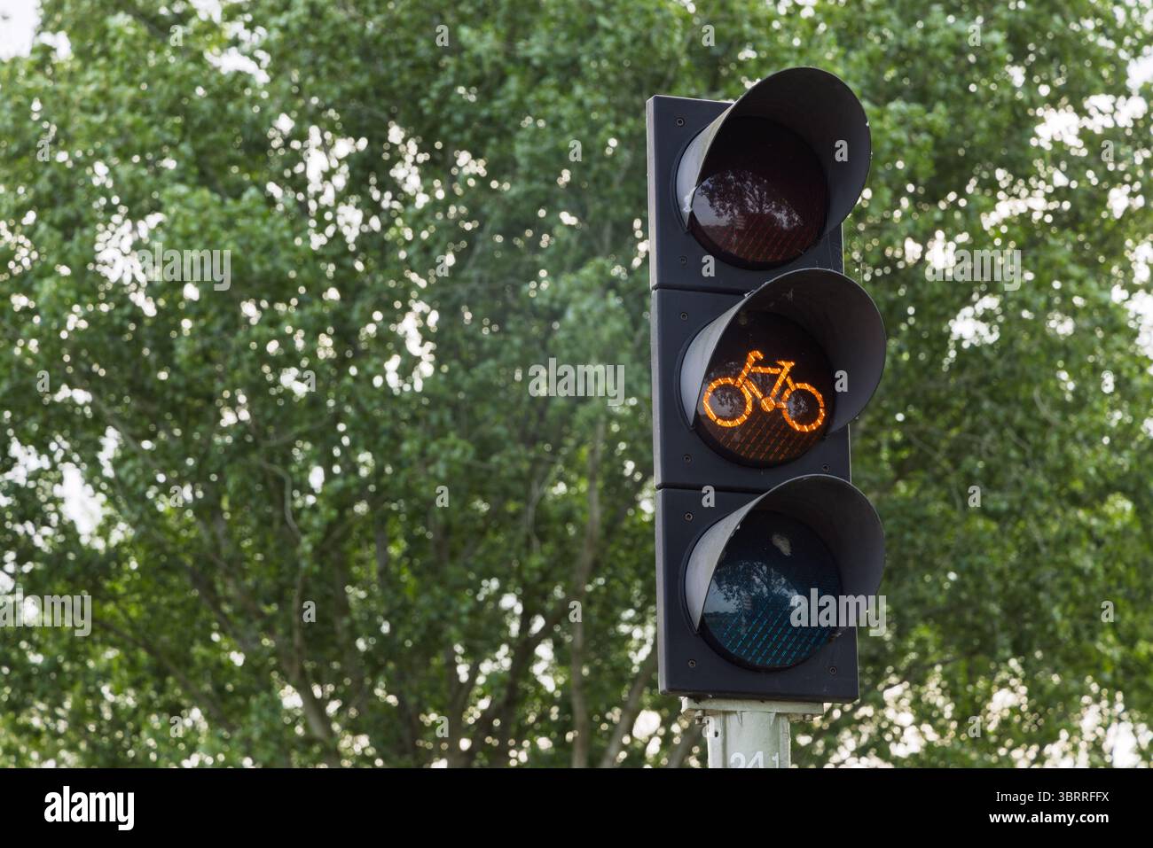 A traffic light in the Netherlands showing an illuminated orange ...