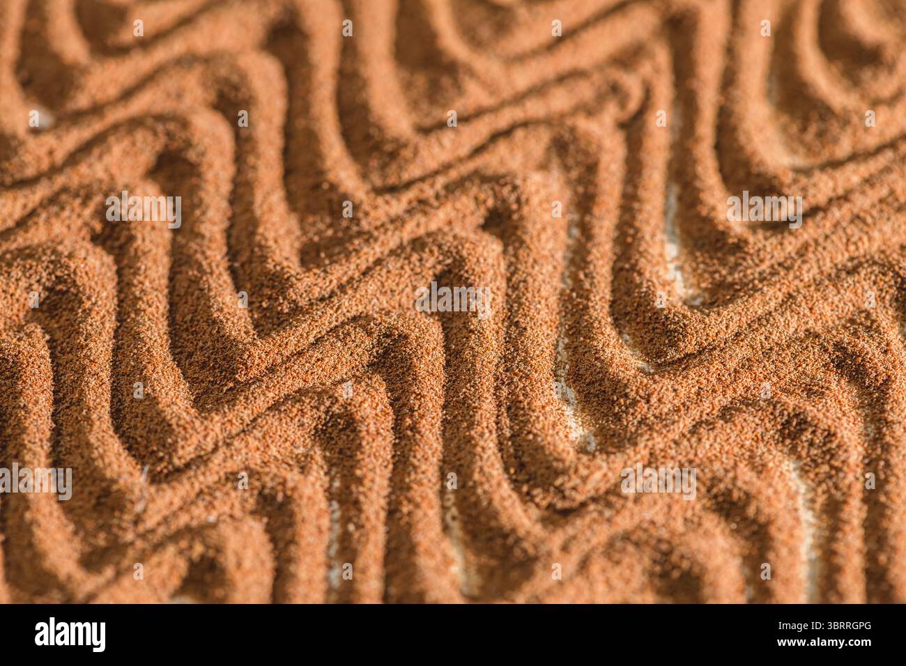 Ground chicory root forming a wavy pattern creates an intriguing ...