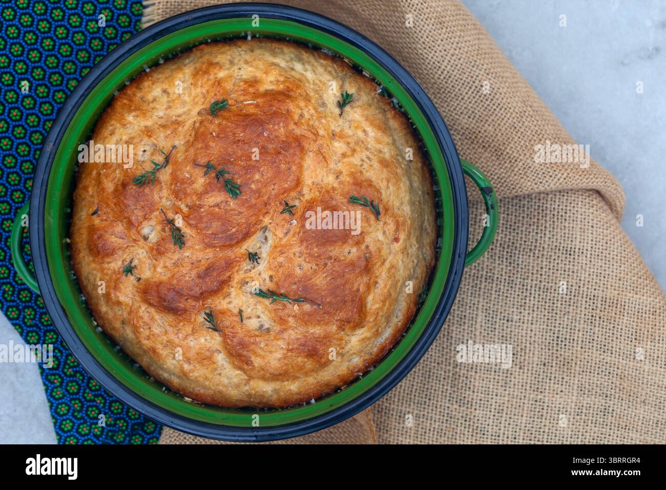 Traditional South African pot bread. Freshly baked in a green pot and ...