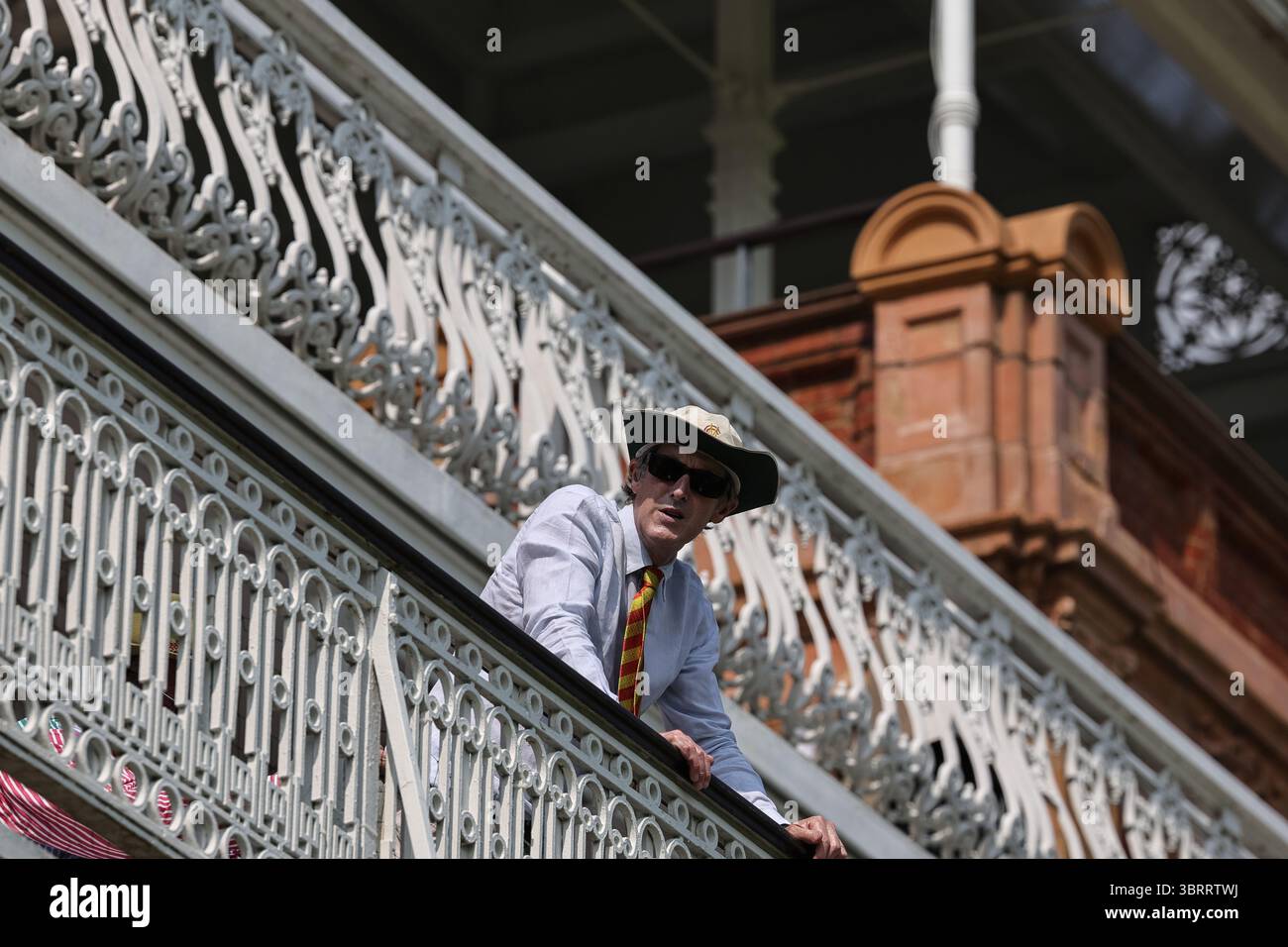 Marylebone Cricket Club members sit in the sun in the Lords Pavilion ...