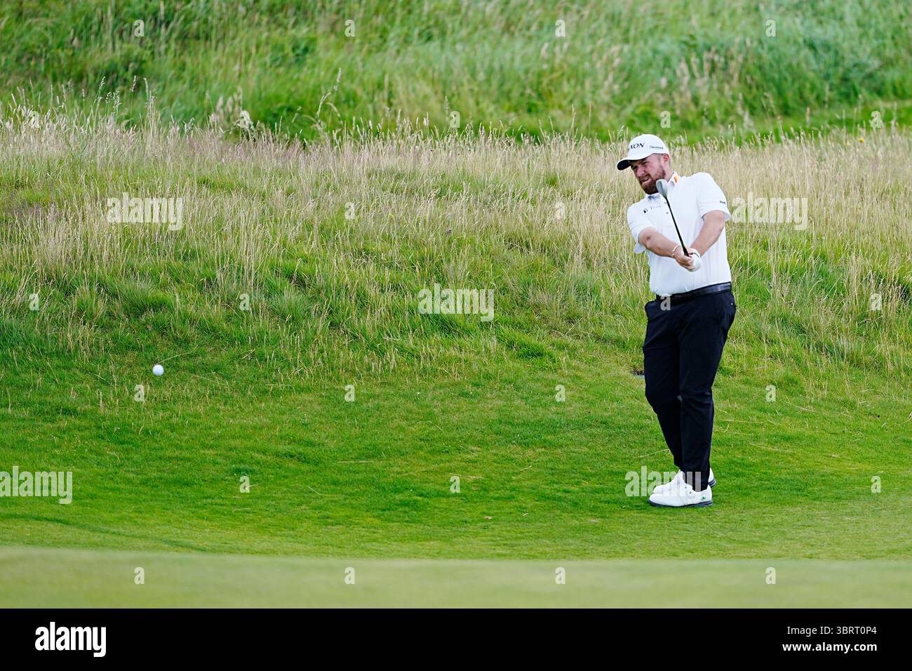 Ireland's Shane Lowry plays on the 9th fairway during the second ...