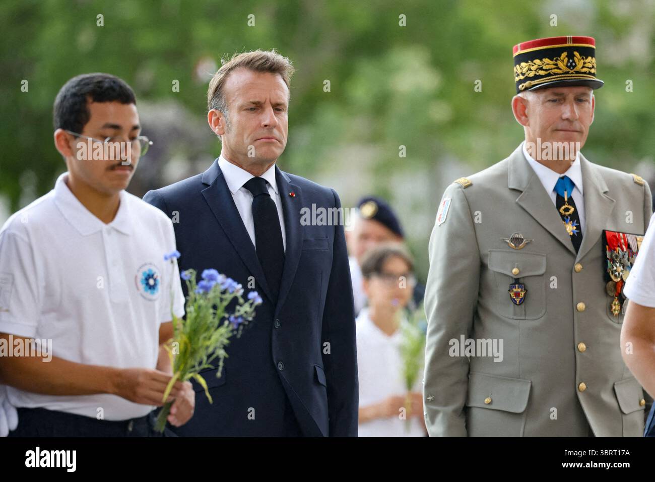 French President Emmanuel Macron presents a new sword to the Flame of ...