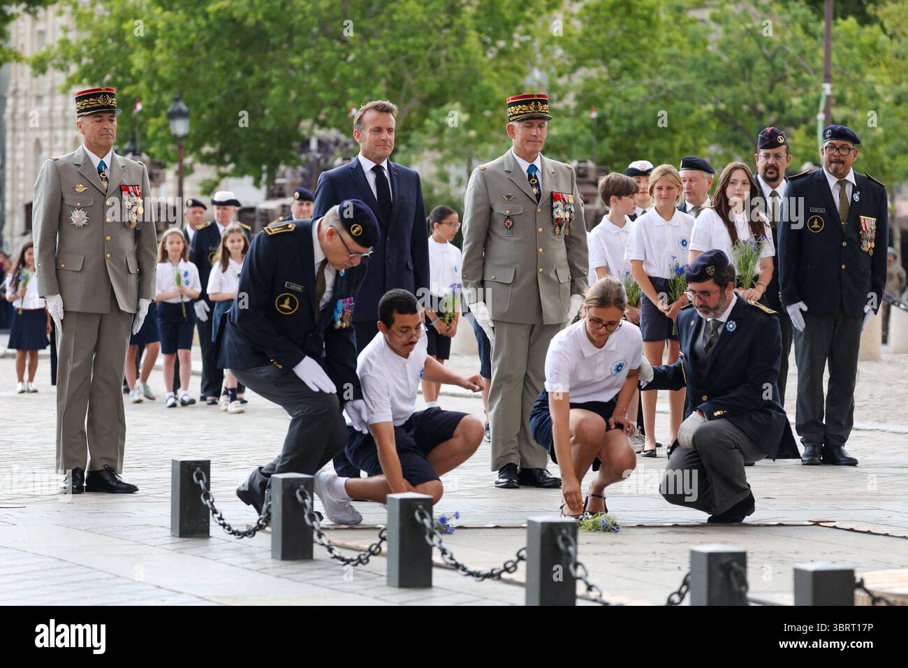 French President Emmanuel Macron presents a new sword to the Flame of ...