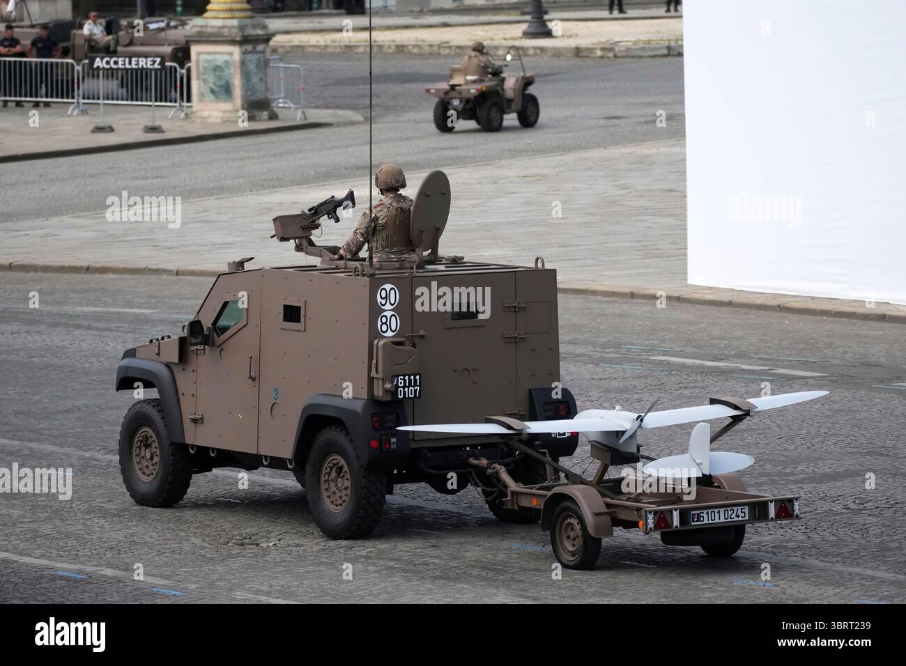 A military drone is pulled during the Bastille Day parade, Monday, July ...