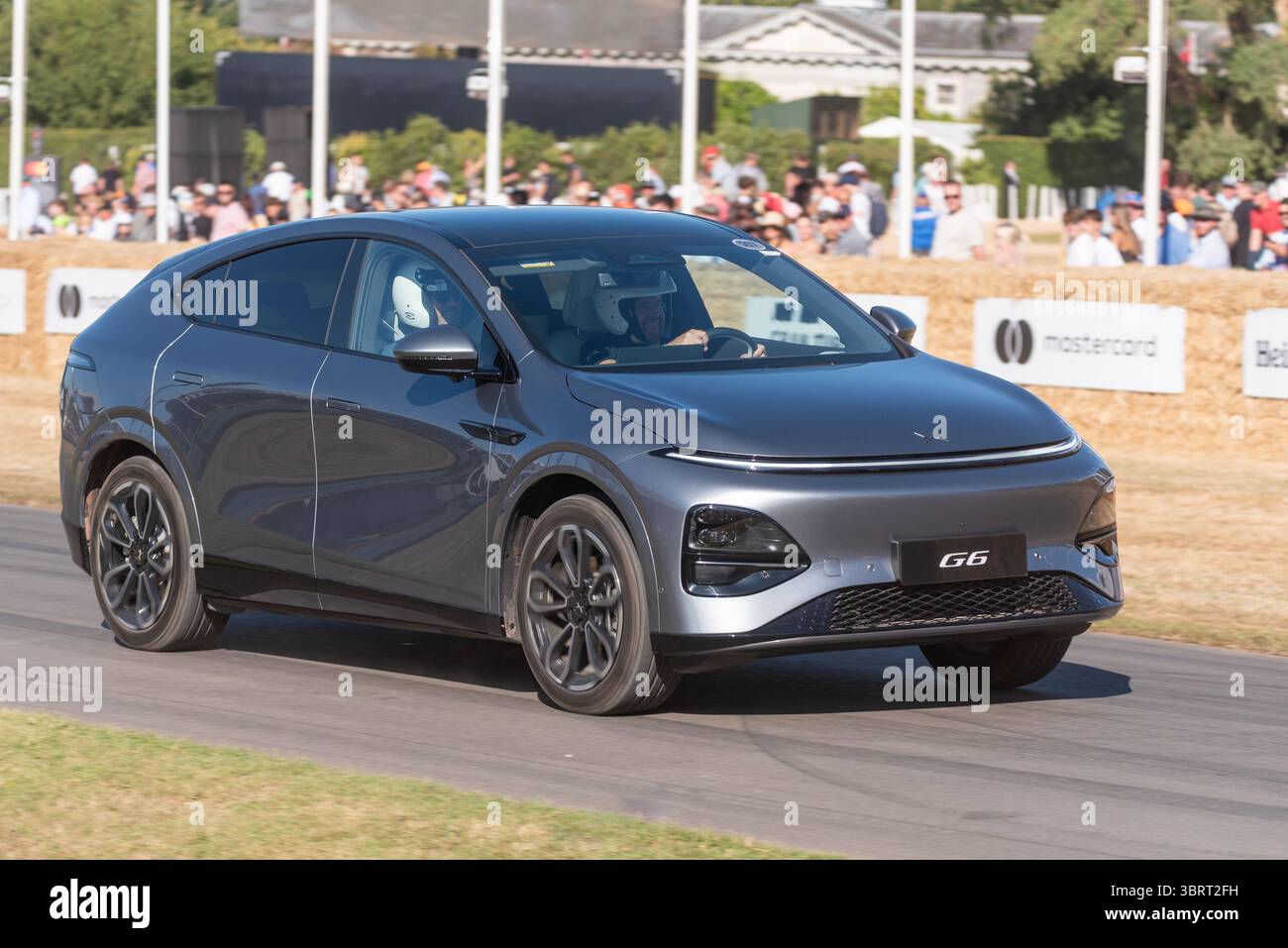 XPENG G6 car driving up the hill climb track at the Goodwood Festival ...