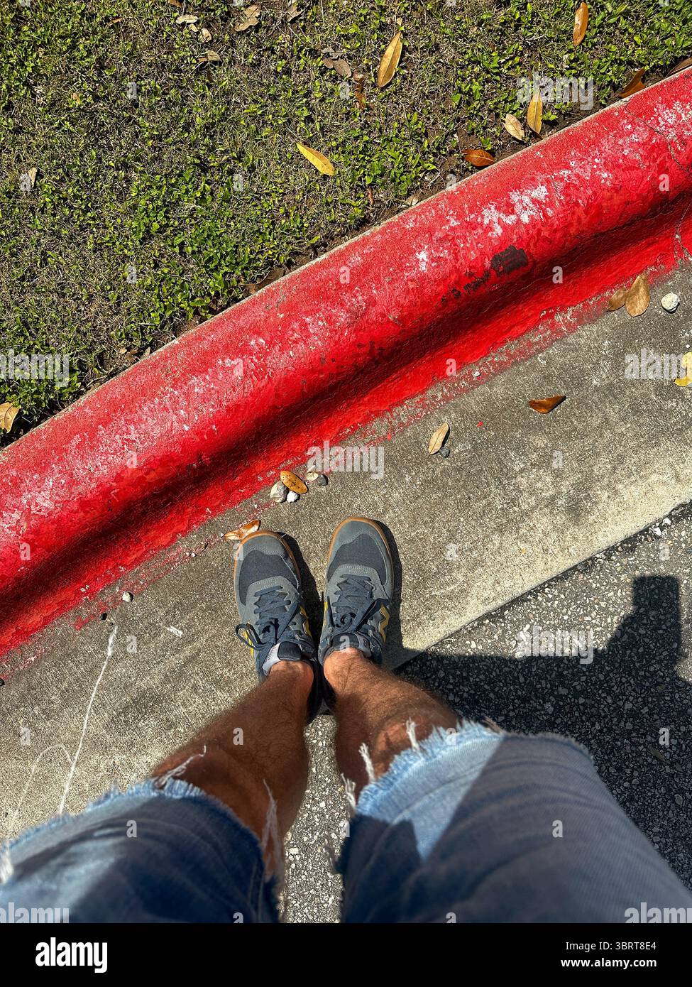 27 May 2025 - Austin, TX, USA - The Red painted curbs of a No Parking ...
