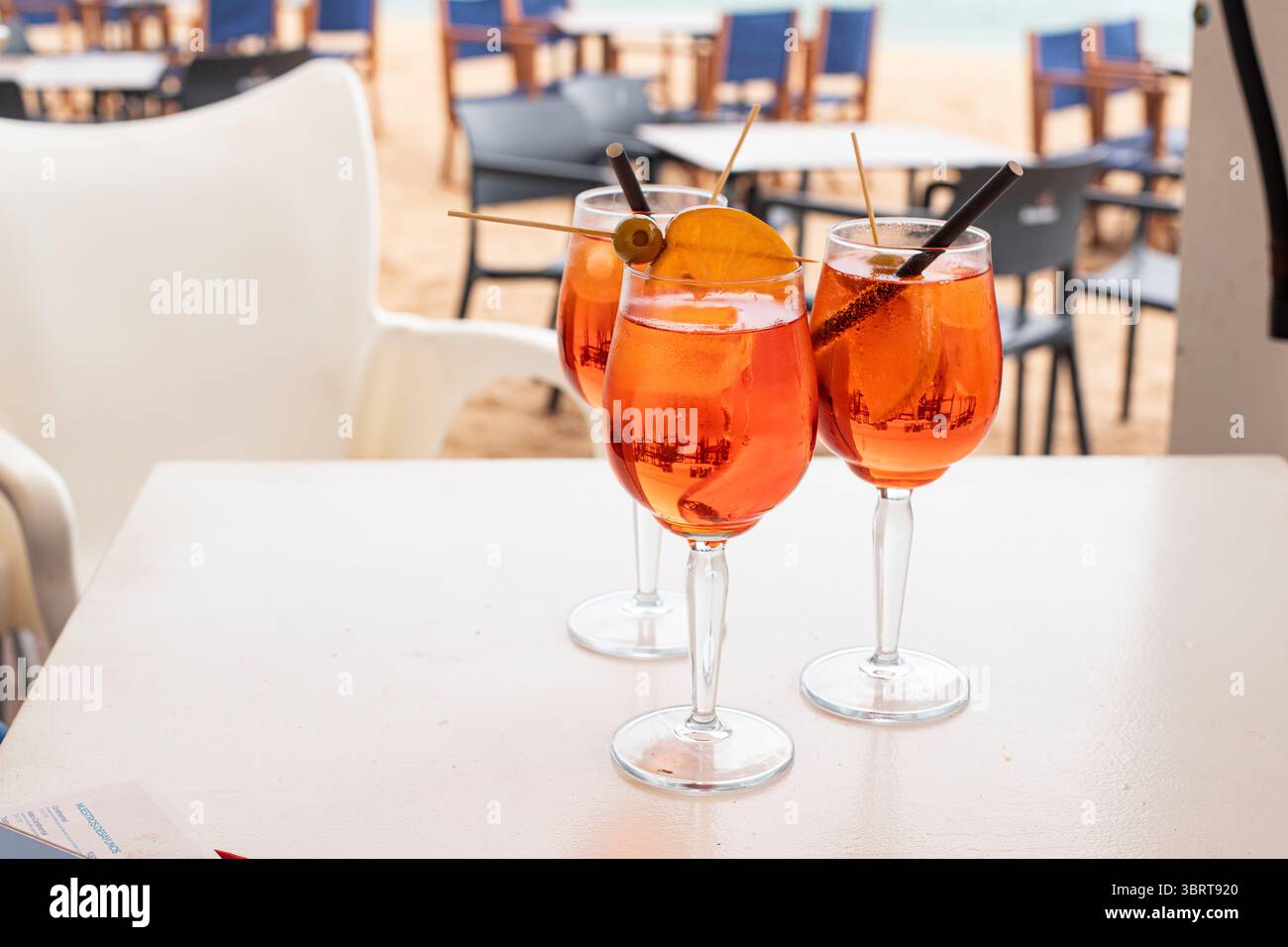Beach bar, the perfect spot for Aperol. Orange drinks against the sea ...