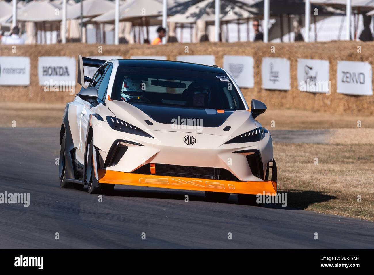 MG EX4 Concept car driving up the hill climb track at the Goodwood ...