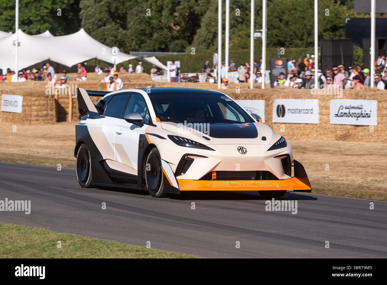 MG EX4 Concept car driving up the hill climb track at the Goodwood ...