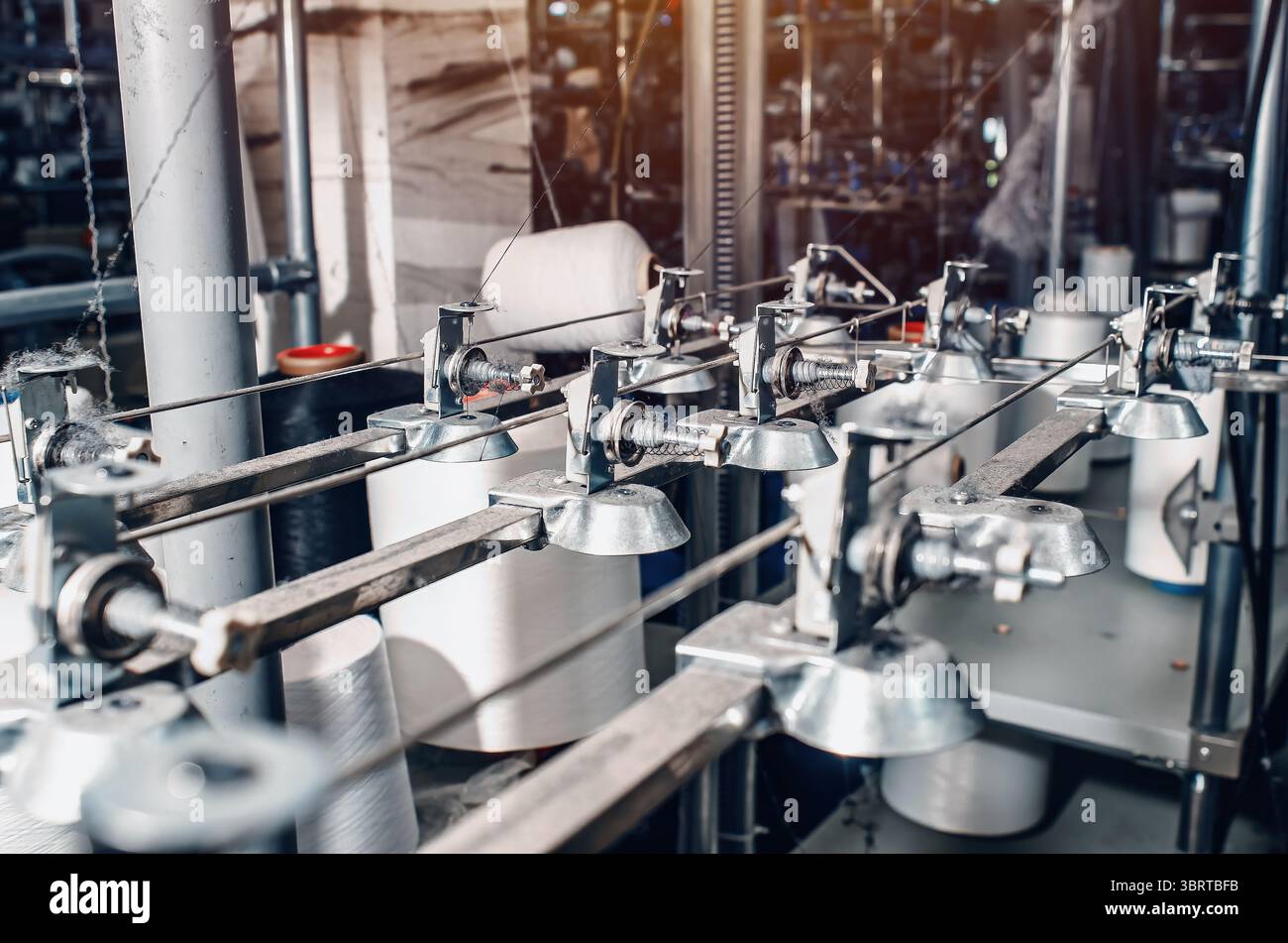 Industrial type of socks production. Sock factory, automated process of ...