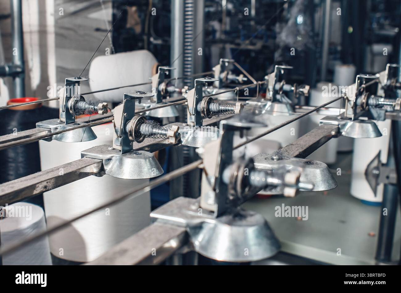 Industrial type of socks production. Sock factory, automated process of ...